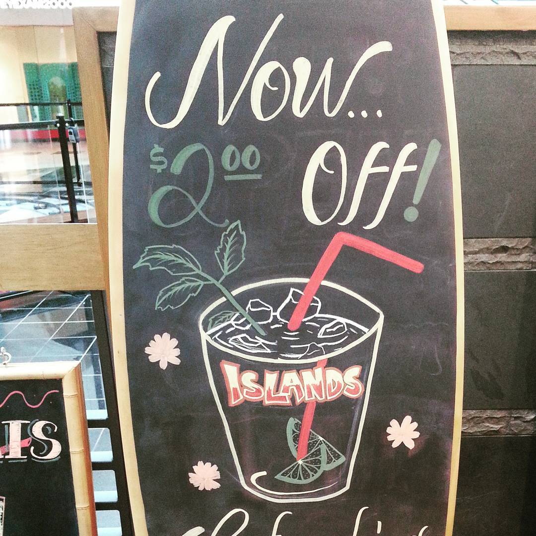 Surfboard Sign Painting at Islands Fine Burgers & Drinks - Clever One Studios